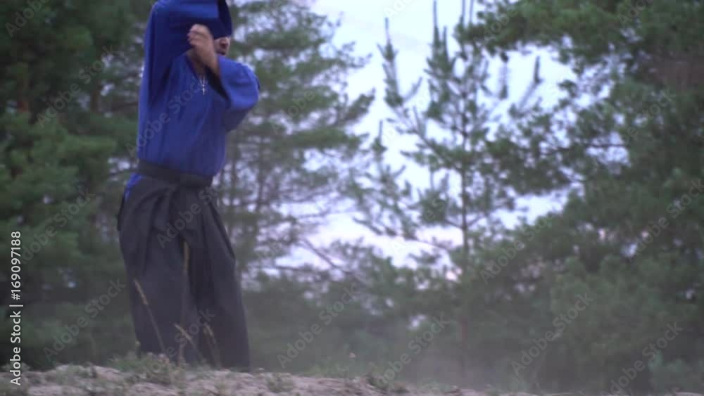 Samurai with a katana pushes a warrior with a halberd and becomes in a ...