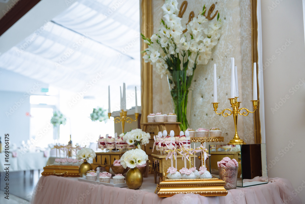 Candy bar. Table with sweets, buffet with cupcakes, candies, dessert ...