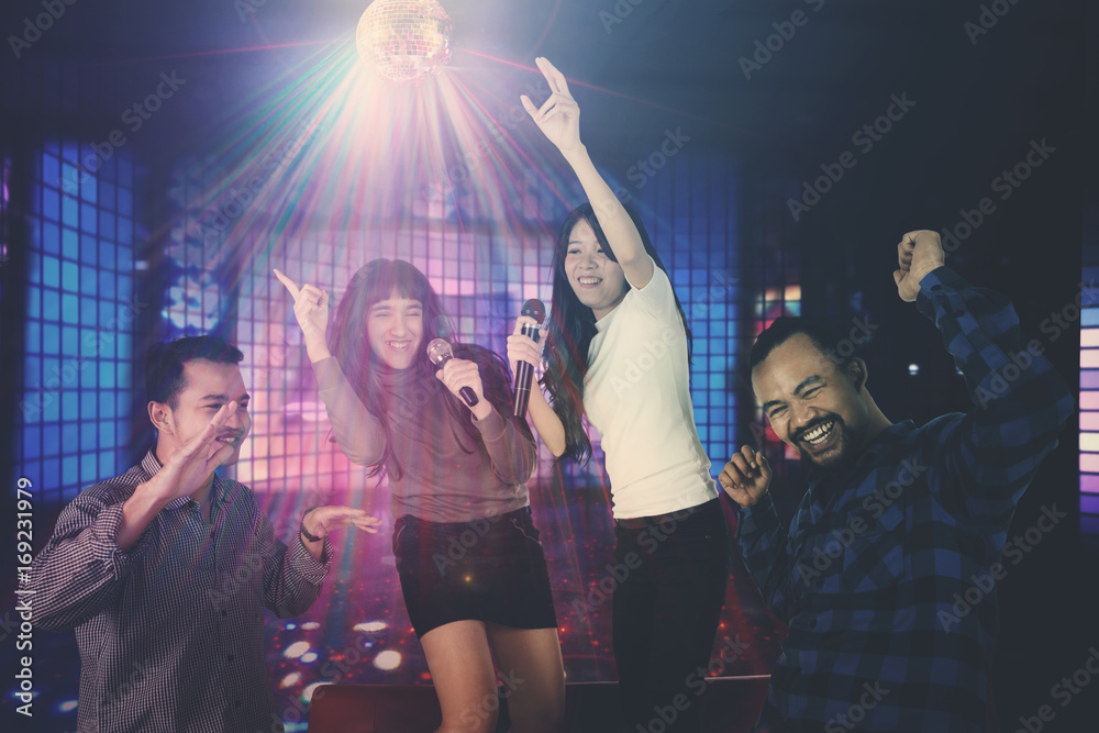 Diverse people having fun in the night club Stock Photo | Adobe Stock