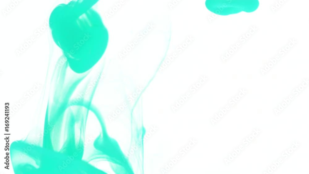 Turquoise ink spreading downward in water. Use for backgrounds or ...