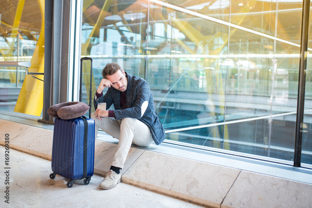 Man upset, sad and angry at the airport his flight is delayed Stock ...