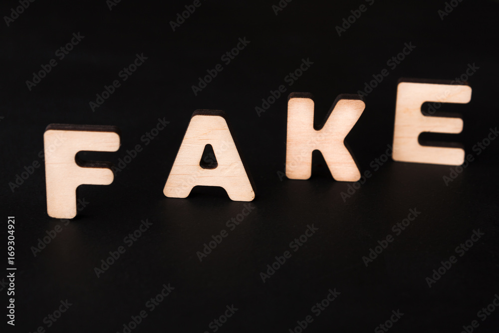 Word Fake on black background Stock Photo | Adobe Stock