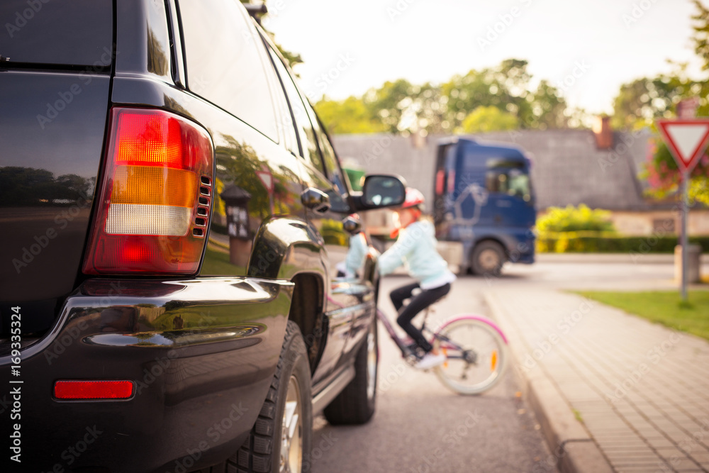 Accident. Girl on the bicycle crosses the road in front of a car Stock ...