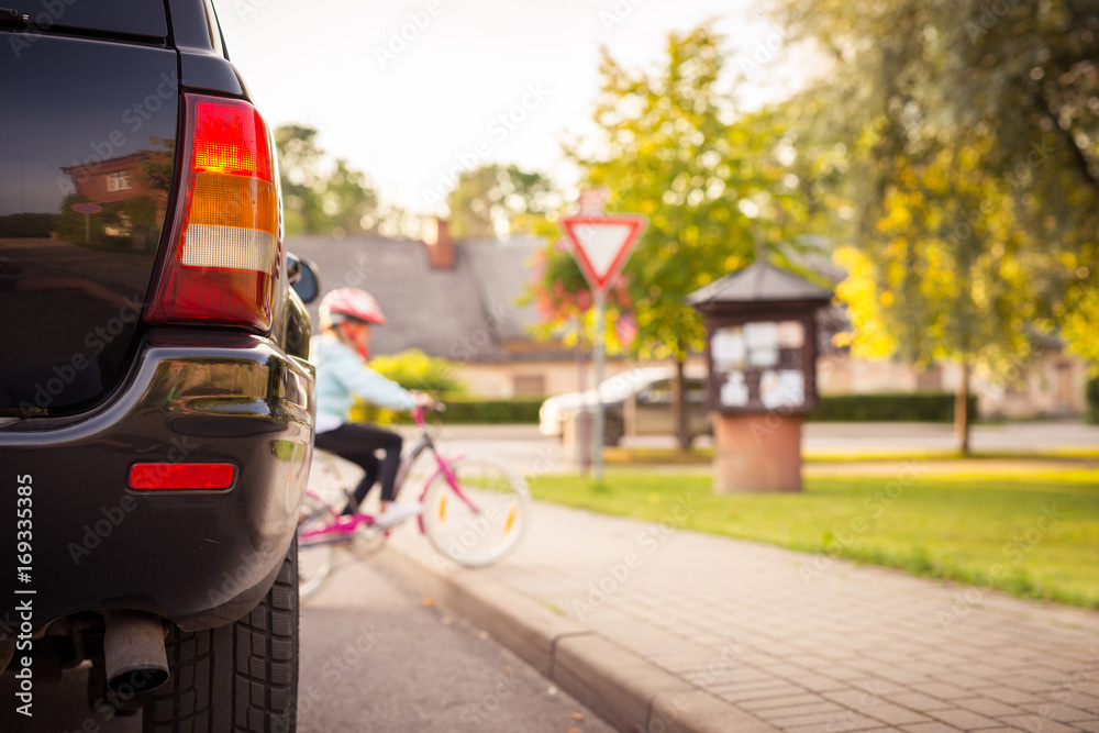 Accident. Girl on the bicycle crosses the road in front of a car Stock ...