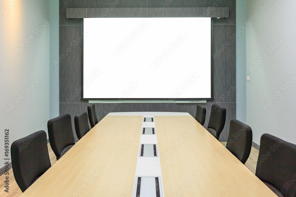 Blank projection screen in meeting room with conference table, Modern ...