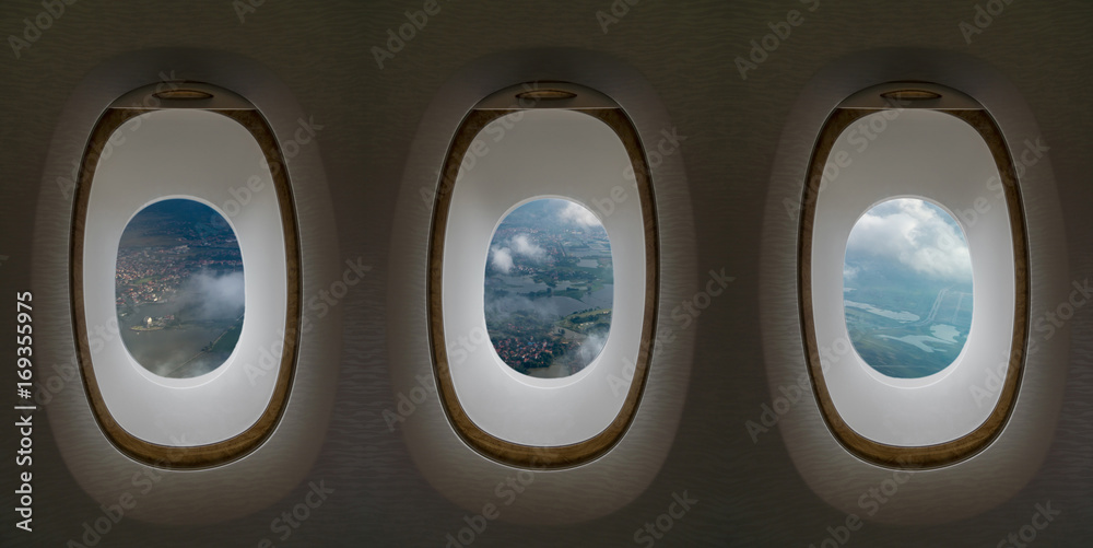 Three Airplane window with Clouds and sky over the country side as seen ...