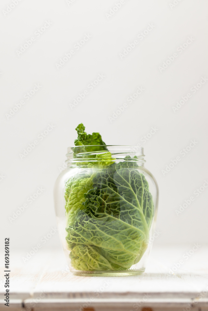 Cabbage leaves in glass jar on white Stock Photo | Adobe Stock