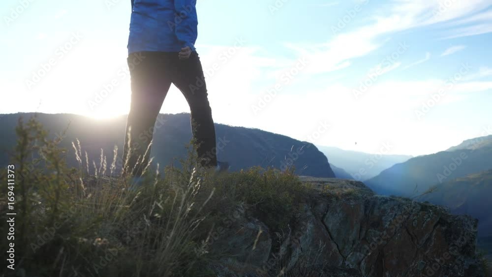Vidéo Stock Success young man raising his hands high on top of the big ...