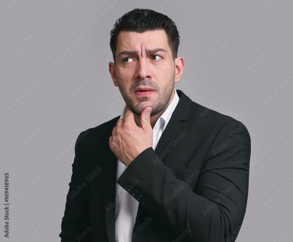 confused businessman thinking about problem Stock Photo | Adobe Stock