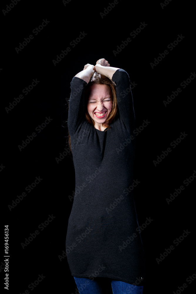 Sad young girl brown hair crying on a black background Stock Photo ...