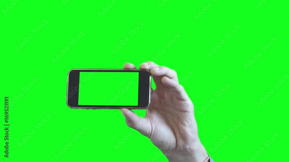 Close Up Male Hand Showing Smartphone On Green Screen. Hand holding a ...