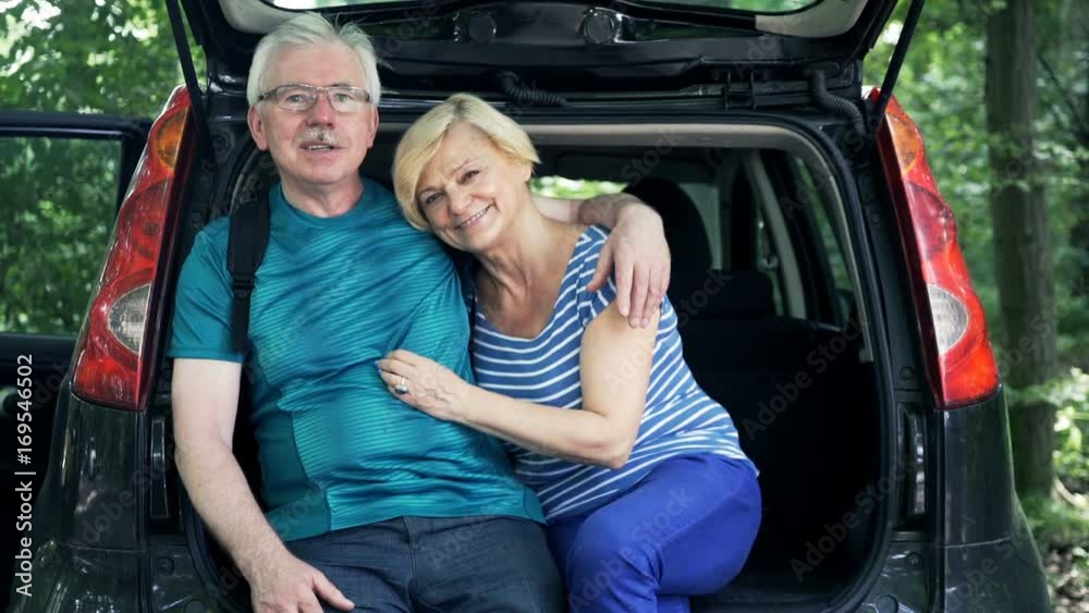 Portrait of middle aged, happy couple sitting in the car Stock Video ...