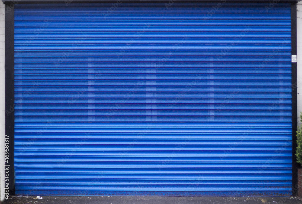 Blue metal shop front shutters Stock Photo | Adobe Stock