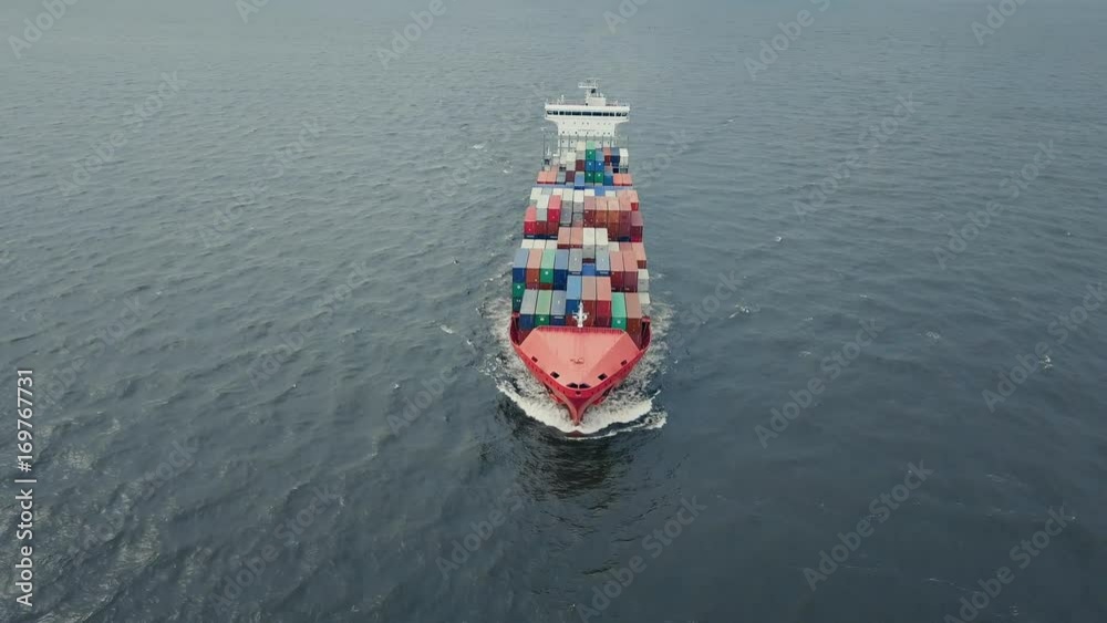 Aerial view of cargo vessel sailing in open sea Stock Video | Adobe Stock