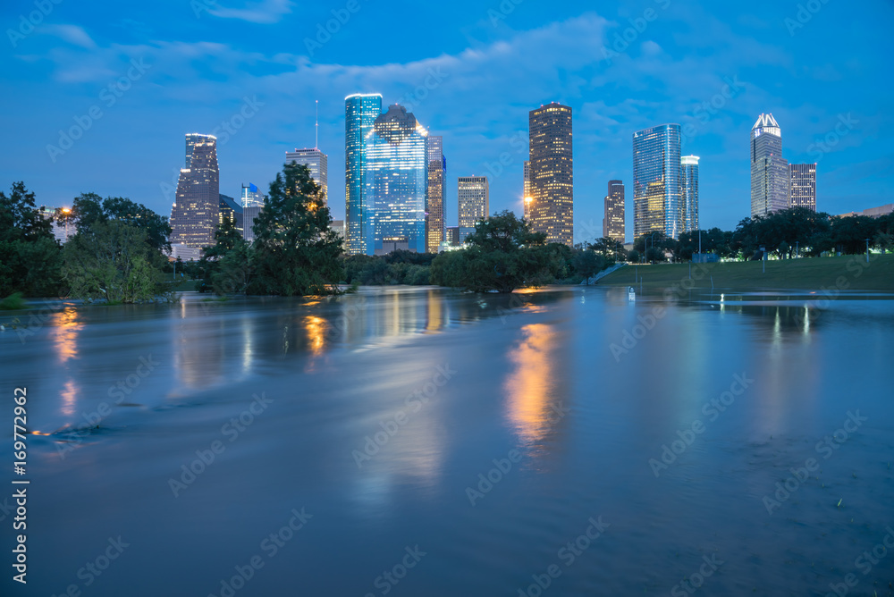 Reflection of Downtown Houston skyscrapers on a pond of overflow water ...