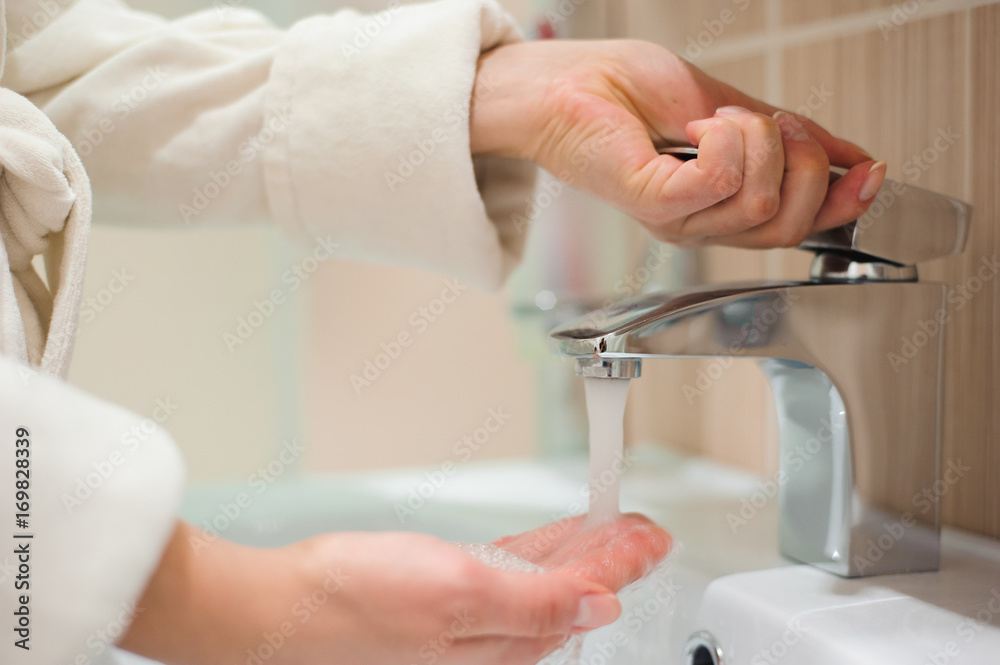 Washing of hands with soap under running water Stock Photo | Adobe Stock