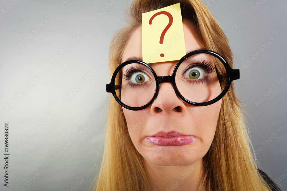 Weirdo nerd woman having question mark on forehead Stock Photo | Adobe ...