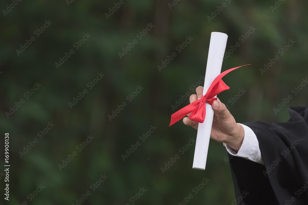 Student hands holding a degree certificate.on the campus.happiness in ...