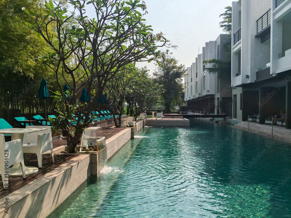 Swimming pool in a pool resort villa style hotel with modern interior ...