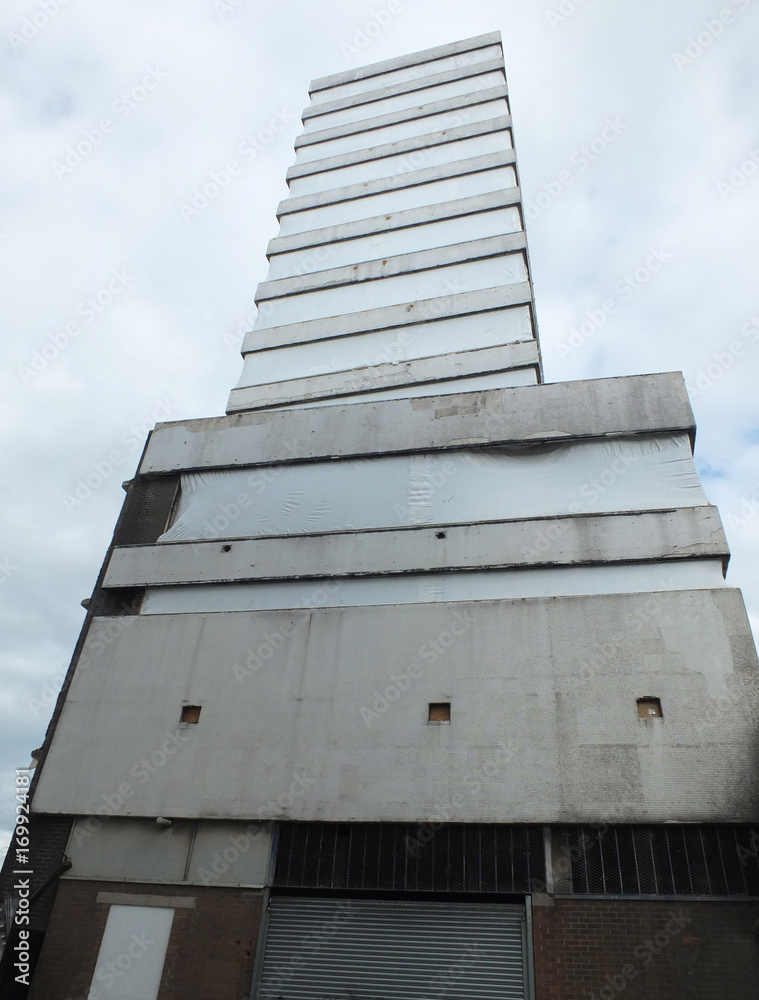 derelict concrete abandoned highrise building awaiting demolition or ...