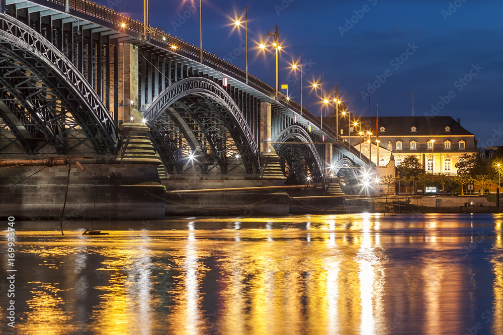 Beautiful sunset night over Rhine / Rhein river and old bridge in Mainz ...