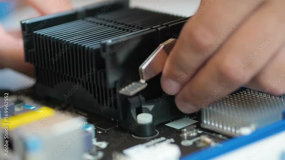 Removing And replacing CPU cooler on modern PC computer motherboard ...