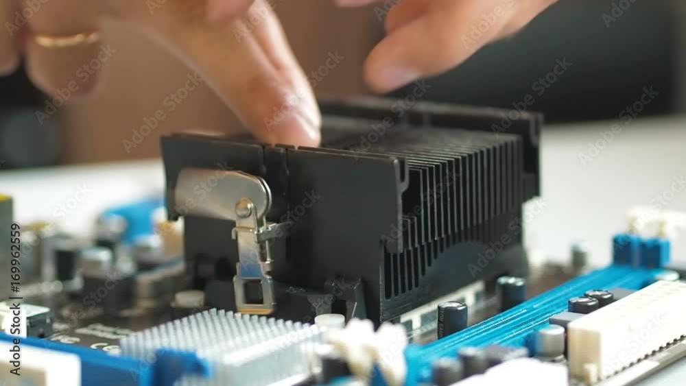 Removing And replacing CPU cooler on modern PC computer motherboard ...