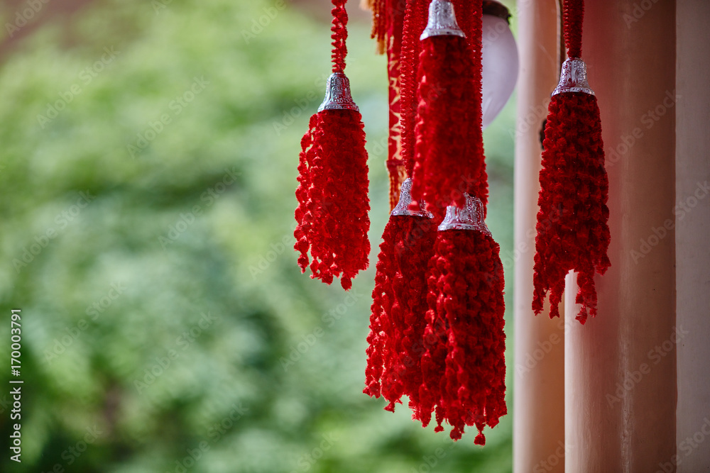 Textile decorations hanging inside Indian temple macro Stock Photo ...