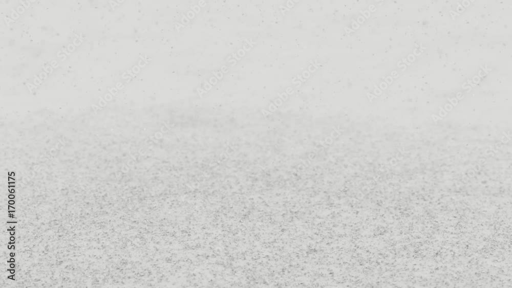 Animated snow flakes falling onto terrain already covered in layer of ...