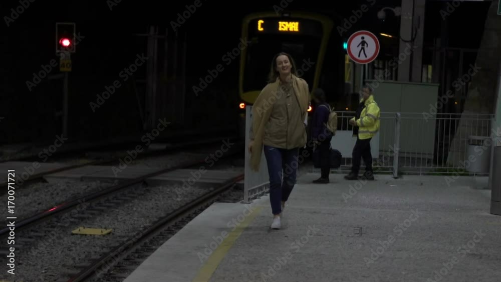 Late, upset woman chasing metro at night Stock Video | Adobe Stock