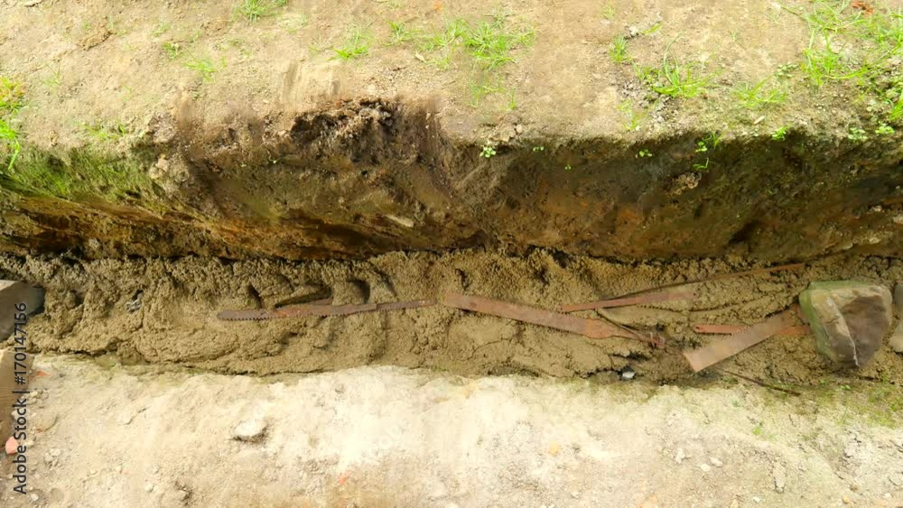 Pouring, laying concrete into foundations of the house using shovel of ...