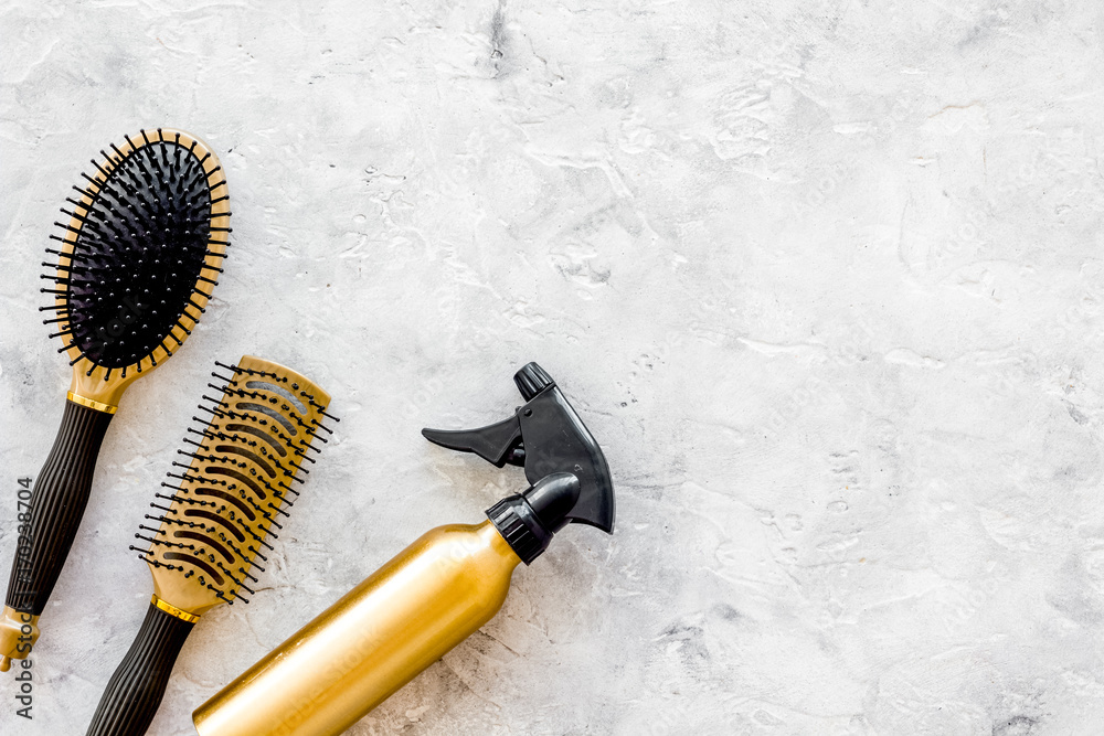 styling hair instruments with combs and brushes in barbershop on stone ...