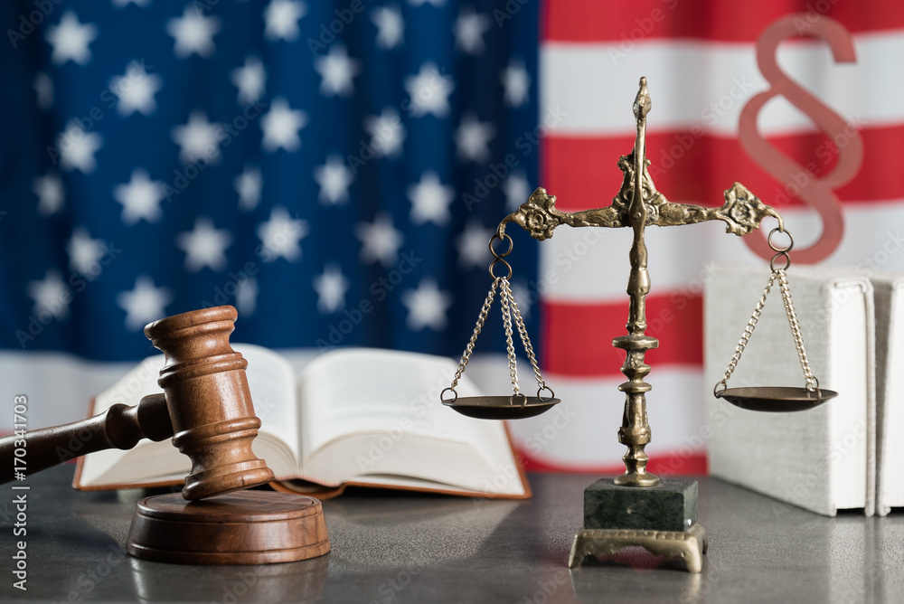 Law symbols on USA flag background. Stock Photo | Adobe Stock