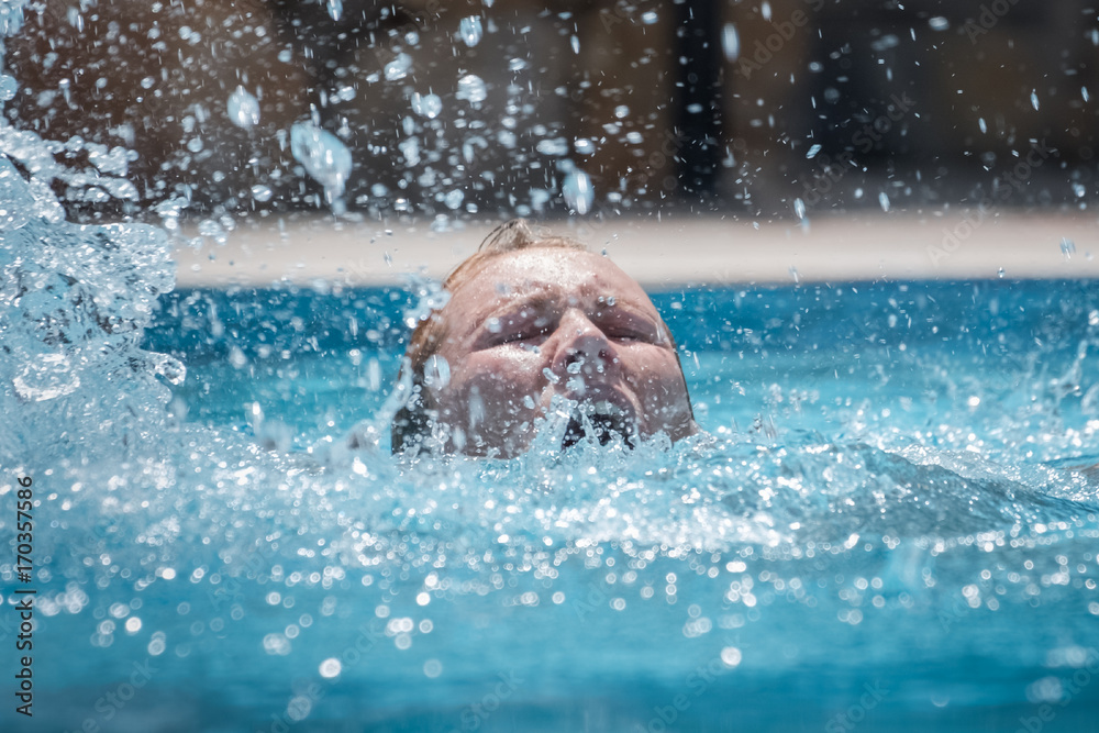 Person drowns in the pool with splashes Stock Photo | Adobe Stock