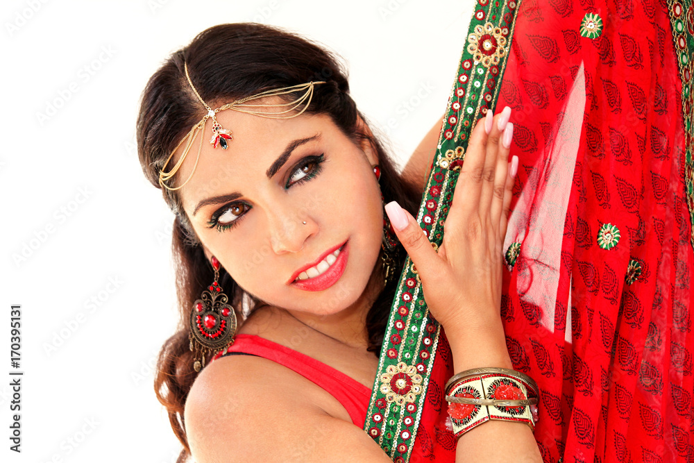 Woman dancing Indian dance in national dress. A handsome beautiful girl ...