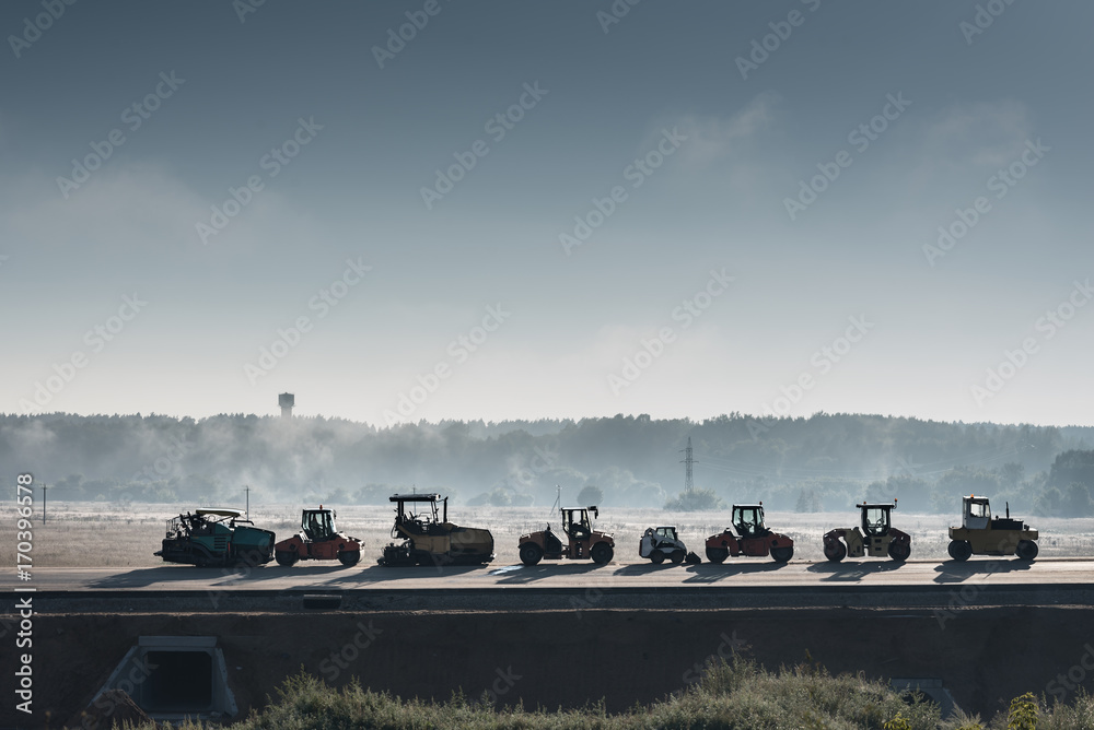 road under construction - wheel loader machine, pneumatic tyred roller ...