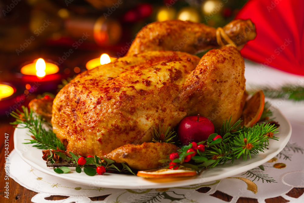 Roasted whole chicken with Christmas decoration. Stock Photo | Adobe Stock