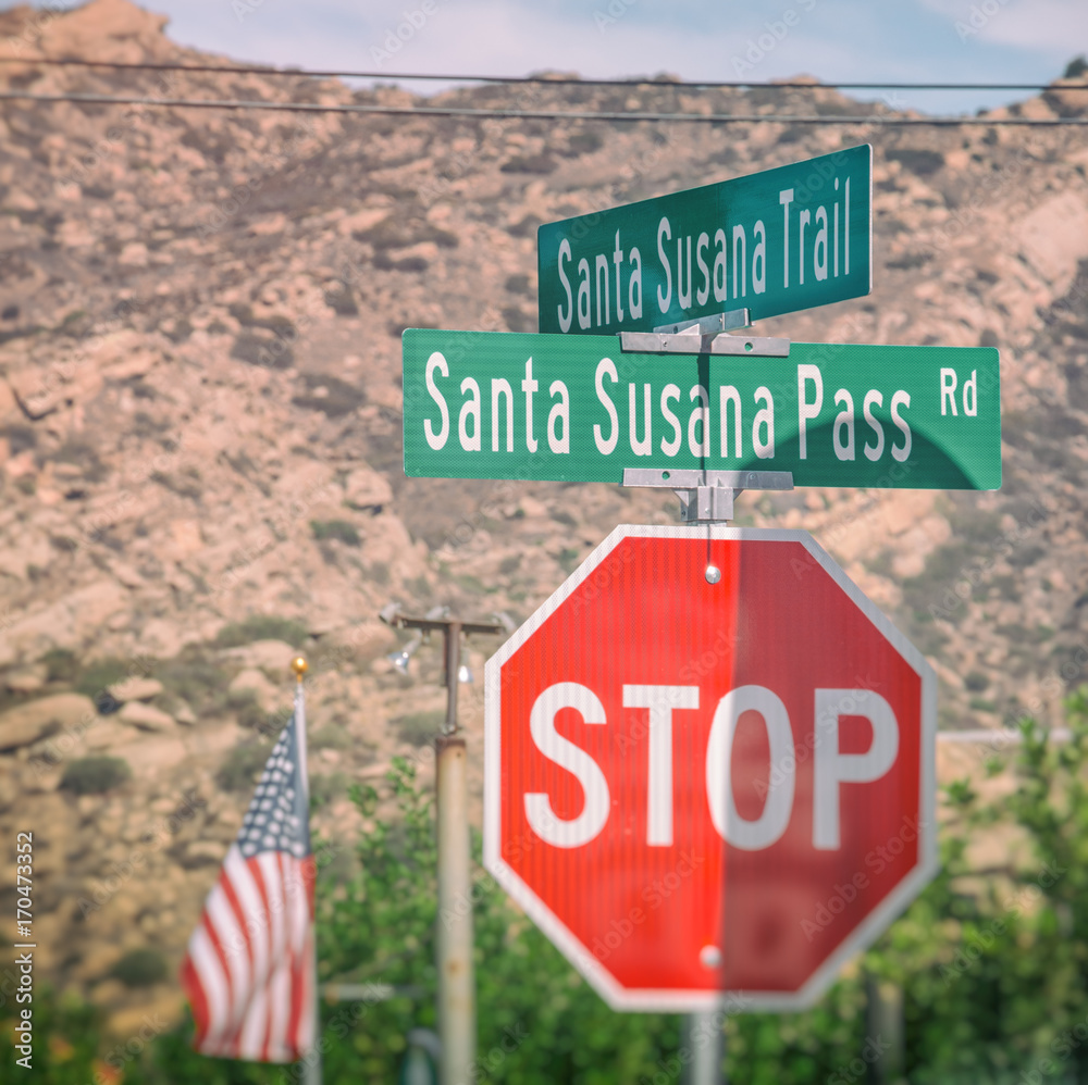 Street signs for the Santa Susana Pass Road and Santa Susana Trail with ...
