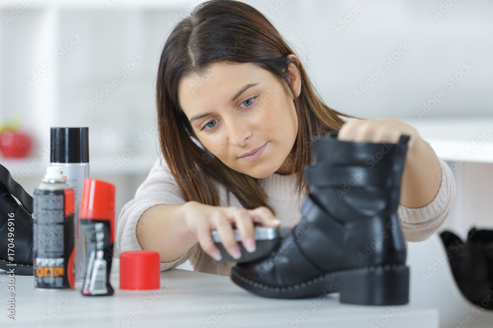 female cleaning shoes Stock Photo | Adobe Stock