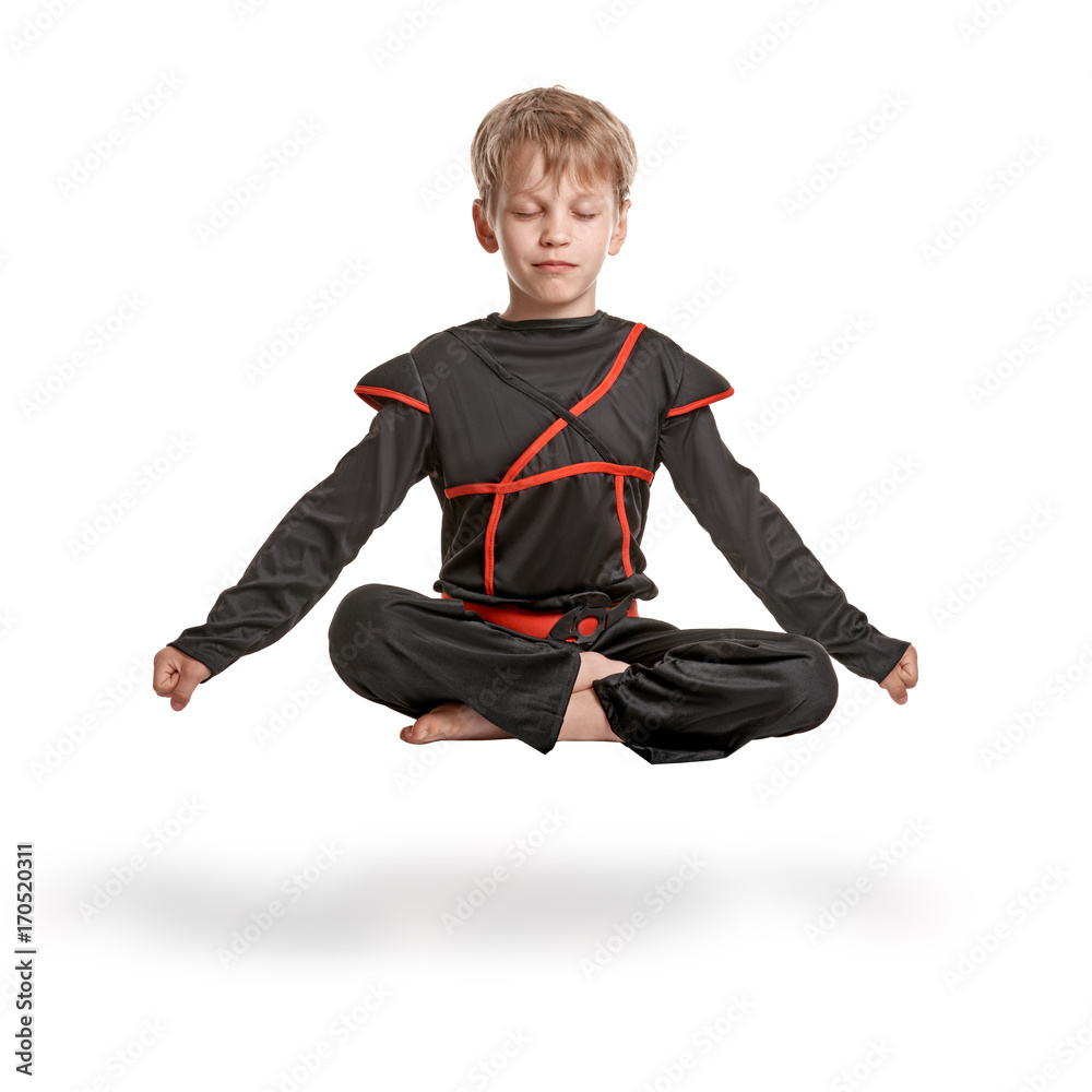Young ninja meditating Stock Photo | Adobe Stock