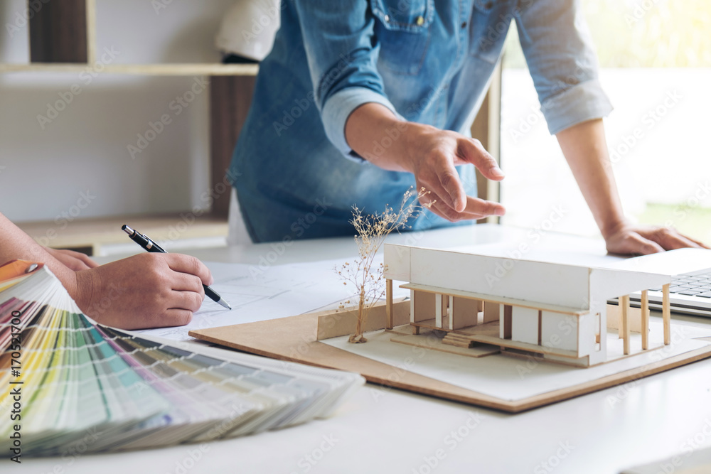 Two young women interior design or graphic designer working on project ...