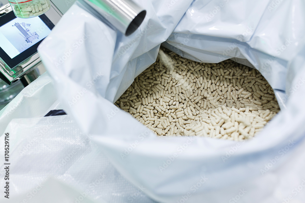 The process of production of drugs and tablets close-up. Device for ...