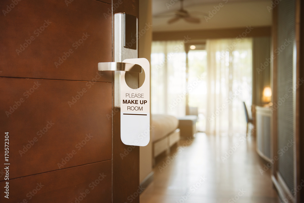 The hotel room with PLEASE MAKE UP ROOM sign on the door Stock Photo ...