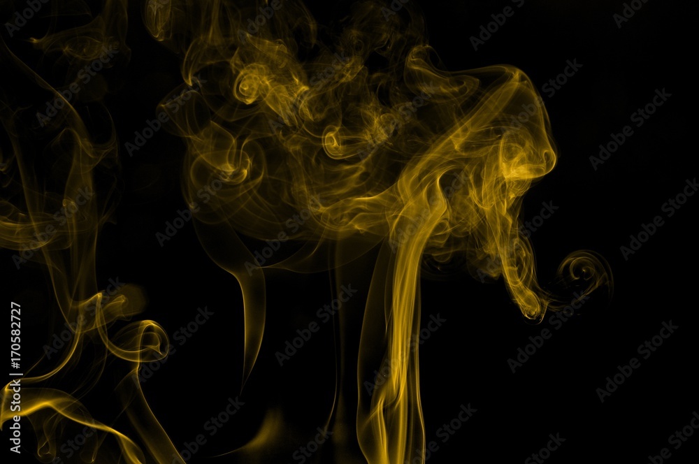 Gold smoke on black background,movement of gold smoke, Abstract gold ...