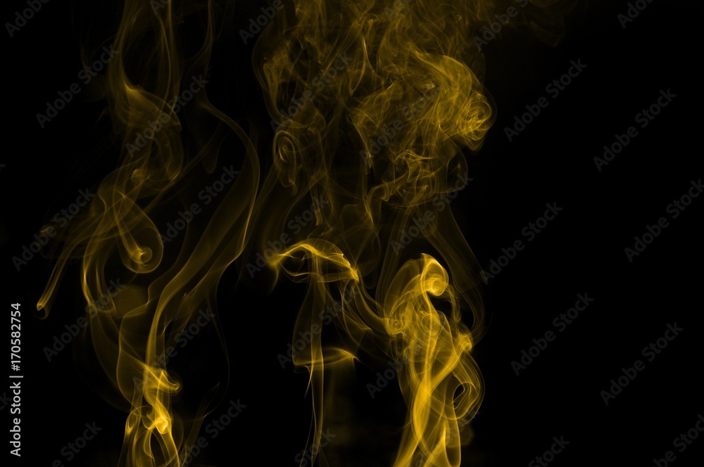 Gold smoke on black background,movement of gold smoke, Abstract gold ...