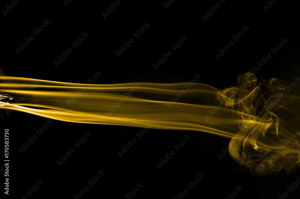 Gold smoke on black background,movement of gold smoke, Abstract gold ...