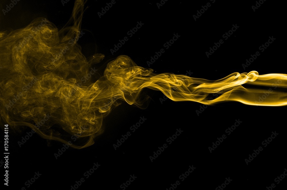 Gold smoke on black background,movement of gold smoke, Abstract gold ...