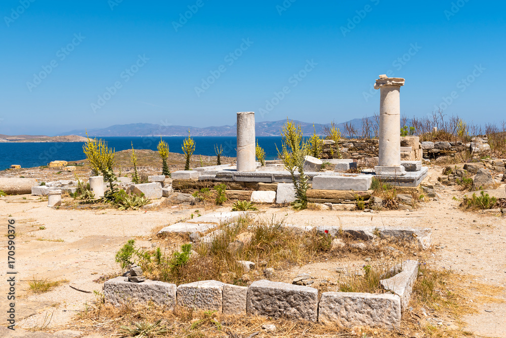 Ancient columns in the Archaeologic Site of Delos island, Cyclades ...
