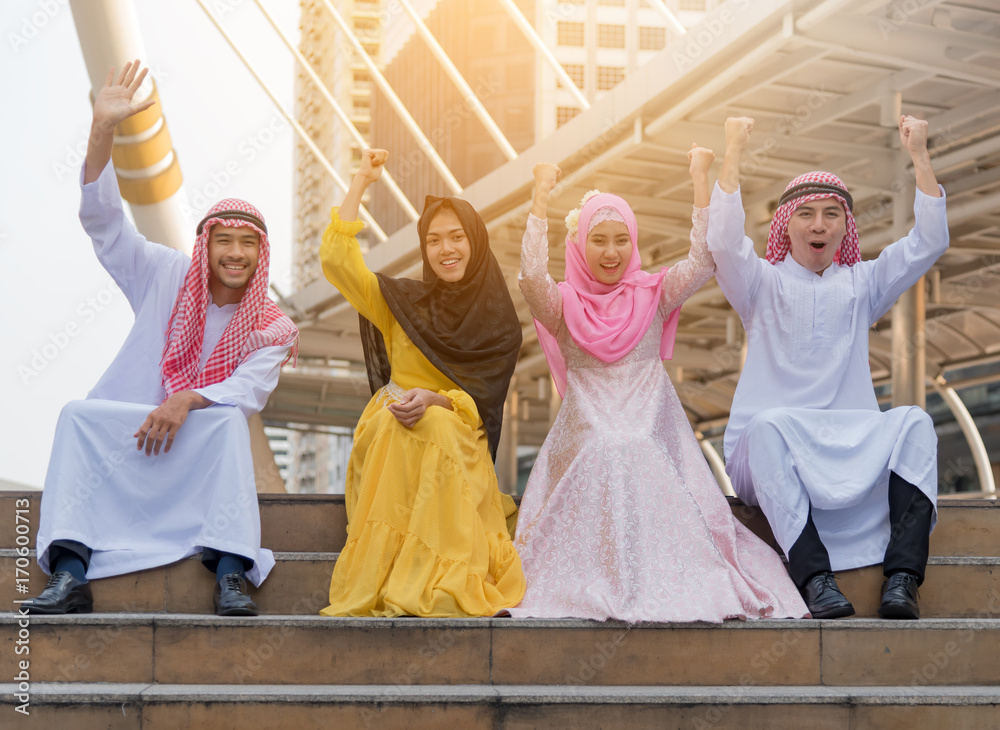 Teamwork of business people Arabic saudi emirates euphoric raising arms ...