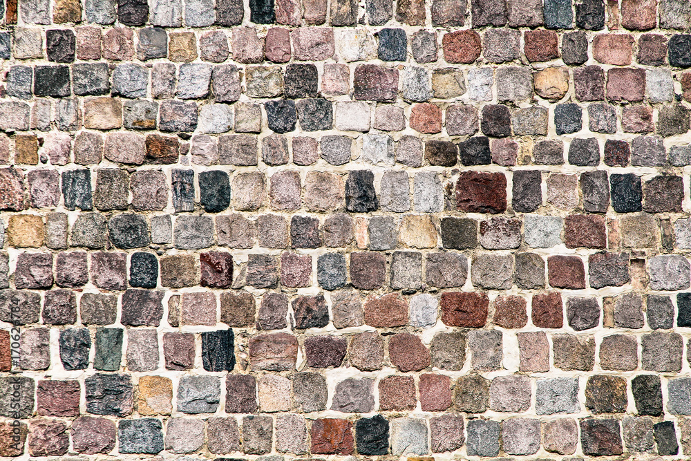 Old medieval restored stonewall texture background. Stone blocks are ...